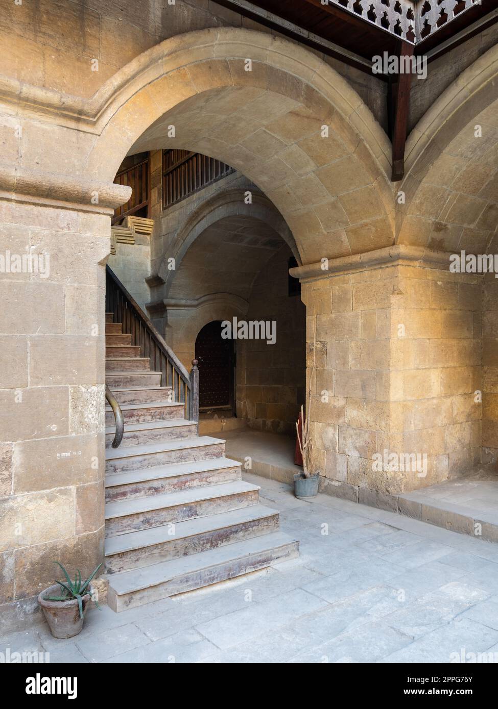 Staircase with wooden balustrade leading to an old abandoned historic ...