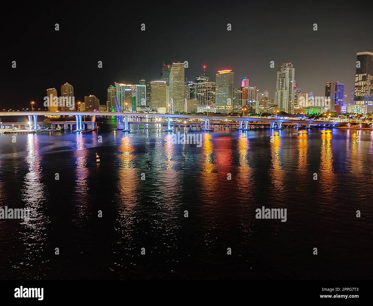 Miami city skyline panorama at dusk with urban skyscrapers and bridge ...