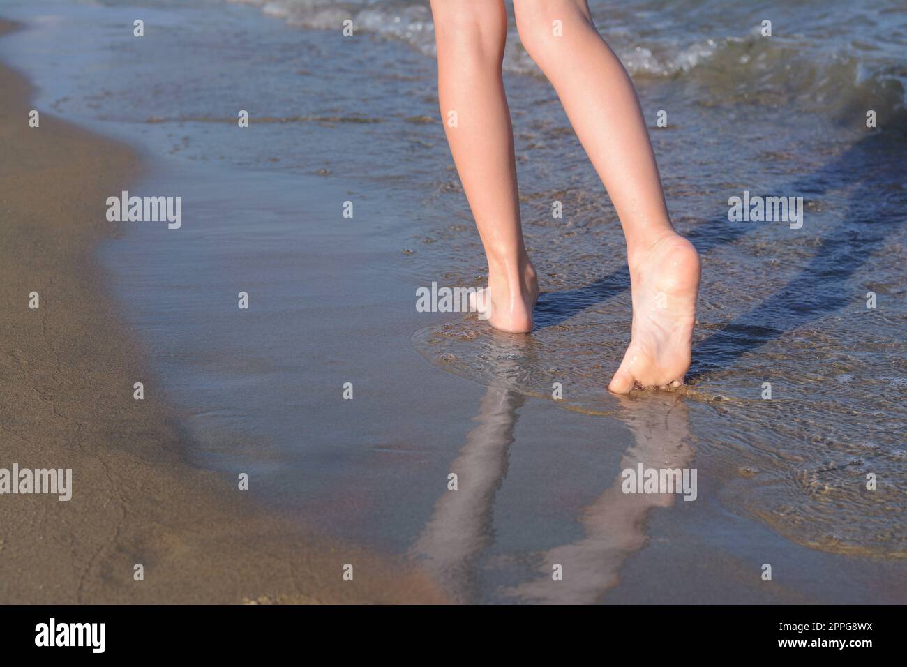 Child walking through water hi-res stock photography and images - Alamy