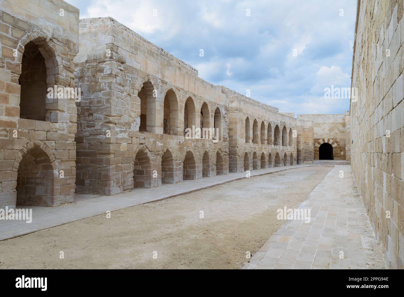 Day shot of aged building of stone blocks with arches and windows Stock ...