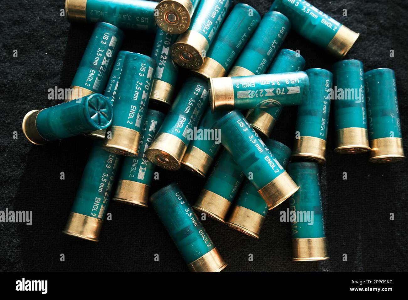 Shotgun shells on a black surface. Ammunition for 12 gauge smoothbore ...