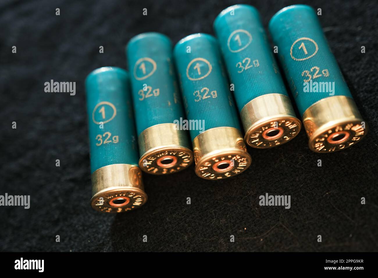 Shotgun shells on a black surface. Ammunition for 12 gauge smoothbore ...