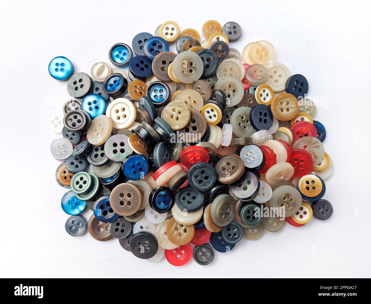 clothing buttons on white background Stock Photo - Alamy
