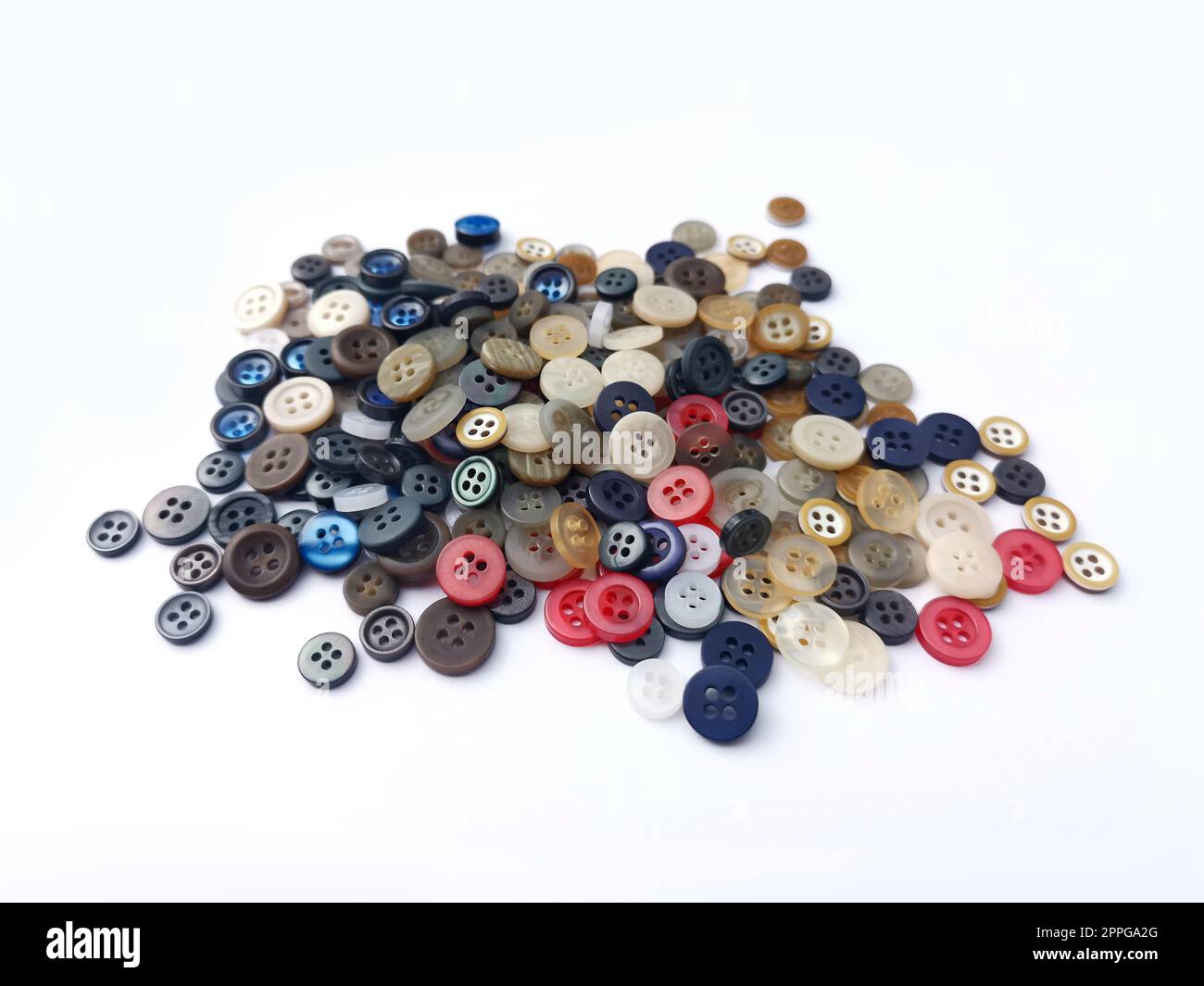 clothing buttons on white background Stock Photo - Alamy