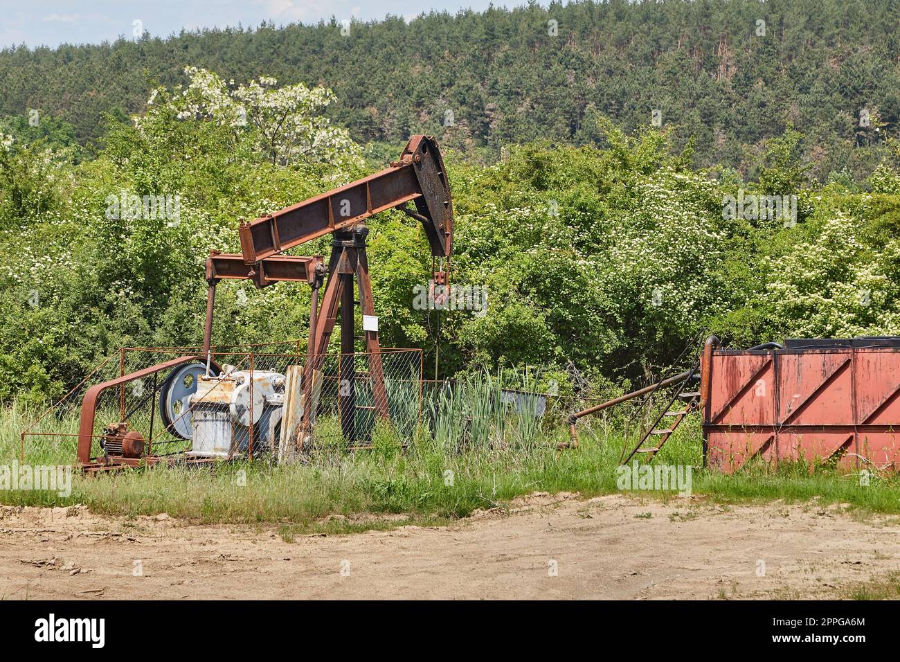 Oil well on a landscape Stock Photo - Alamy