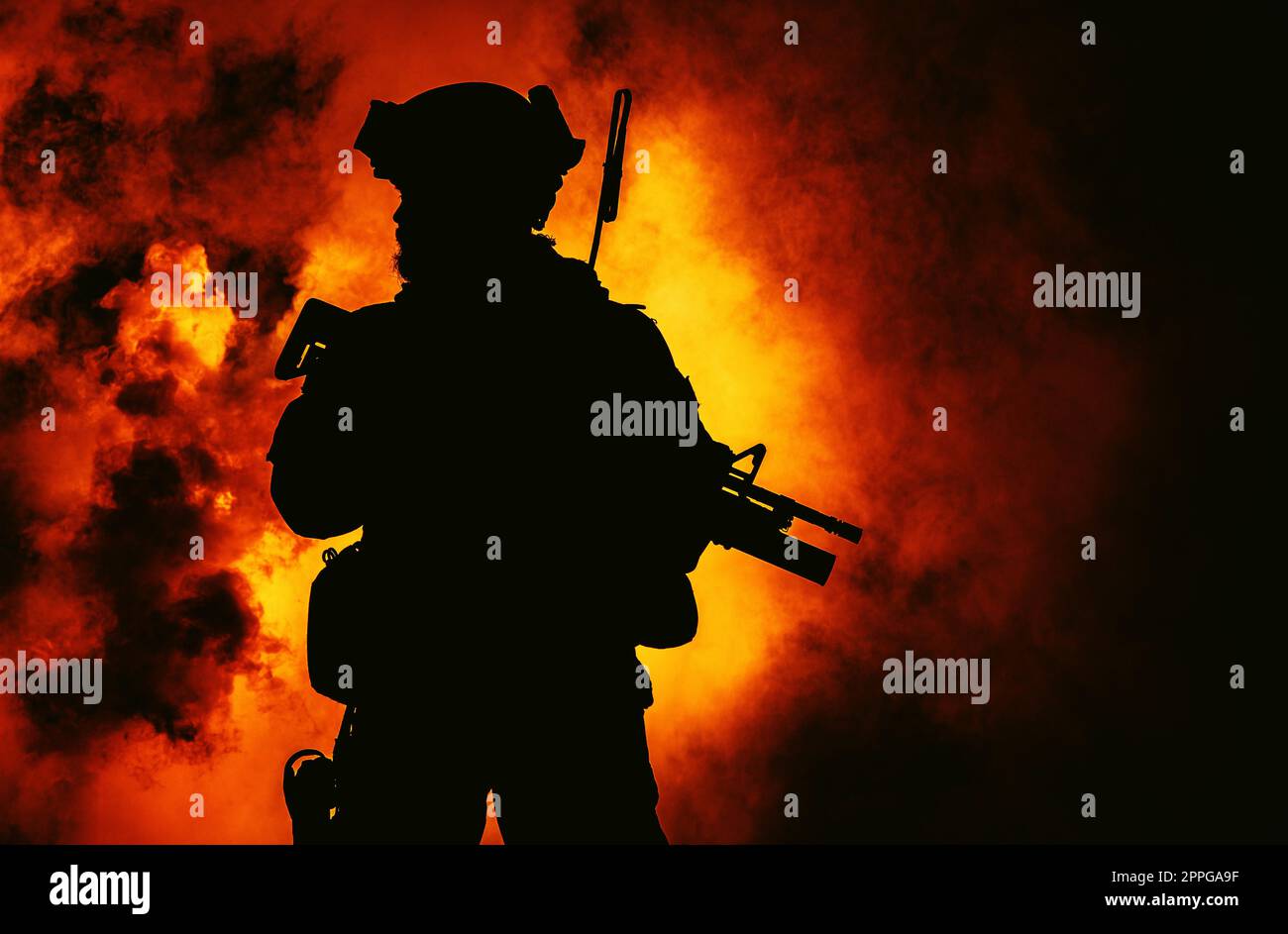 Soldier silhouette on background of fire explosion Stock Photo - Alamy