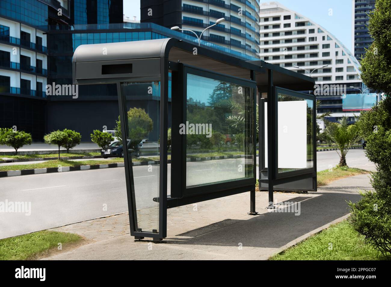 Modern public transport stop on city street Stock Photo - Alamy