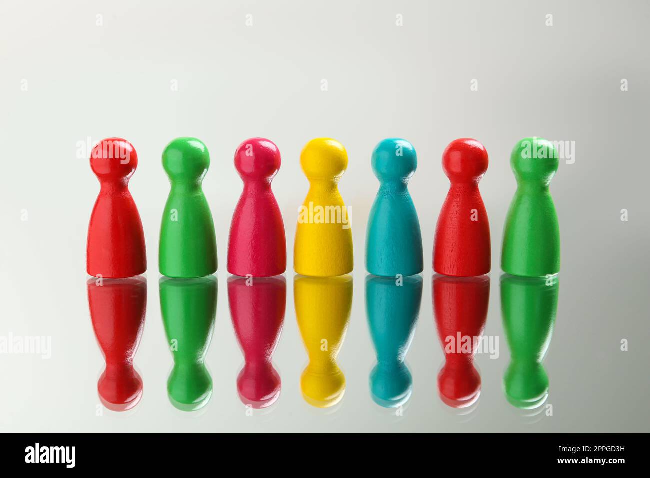 Colorful pawns on white background. Social inclusion concept Stock ...