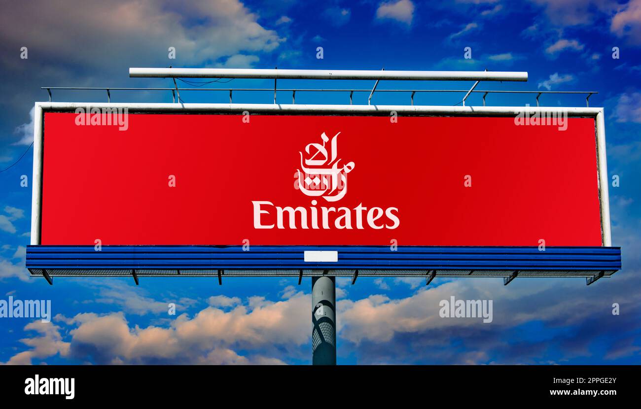Advertisement billboard displaying logo of Emirates Stock Photo - Alamy