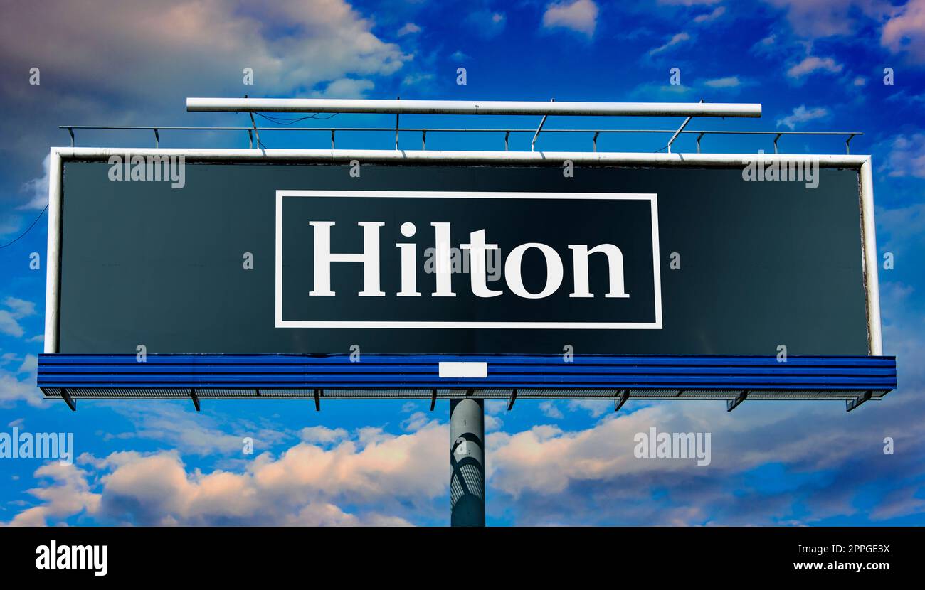 Advertisement billboard displaying logo of Hilton Worldwide Stock Photo ...