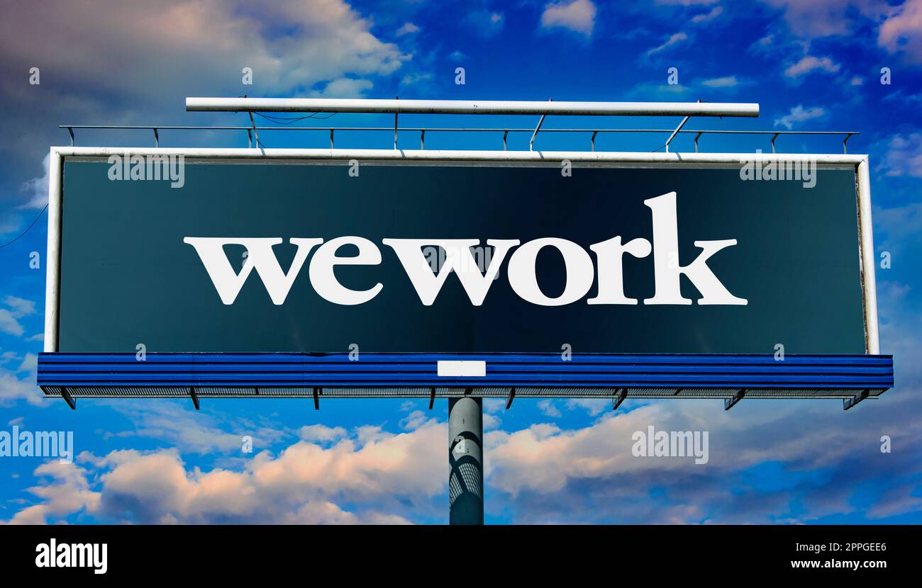 Advertisement billboard displaying logo of WeWork Stock Photo - Alamy