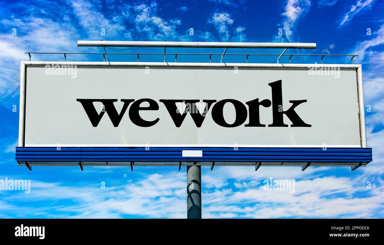 Advertisement billboard displaying logo of WeWork Stock Photo - Alamy