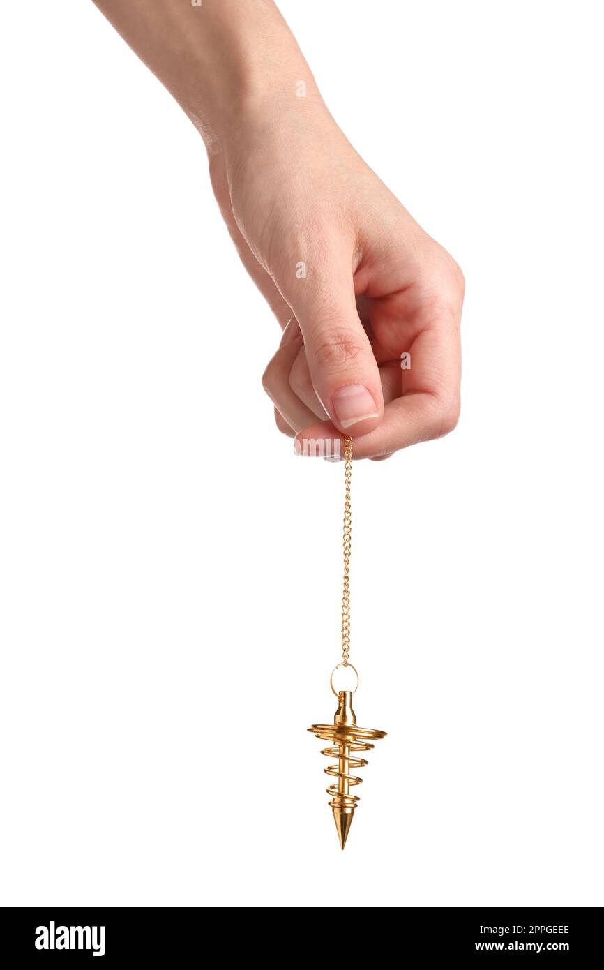 Woman holding golden pendulum with chain on white background, closeup ...