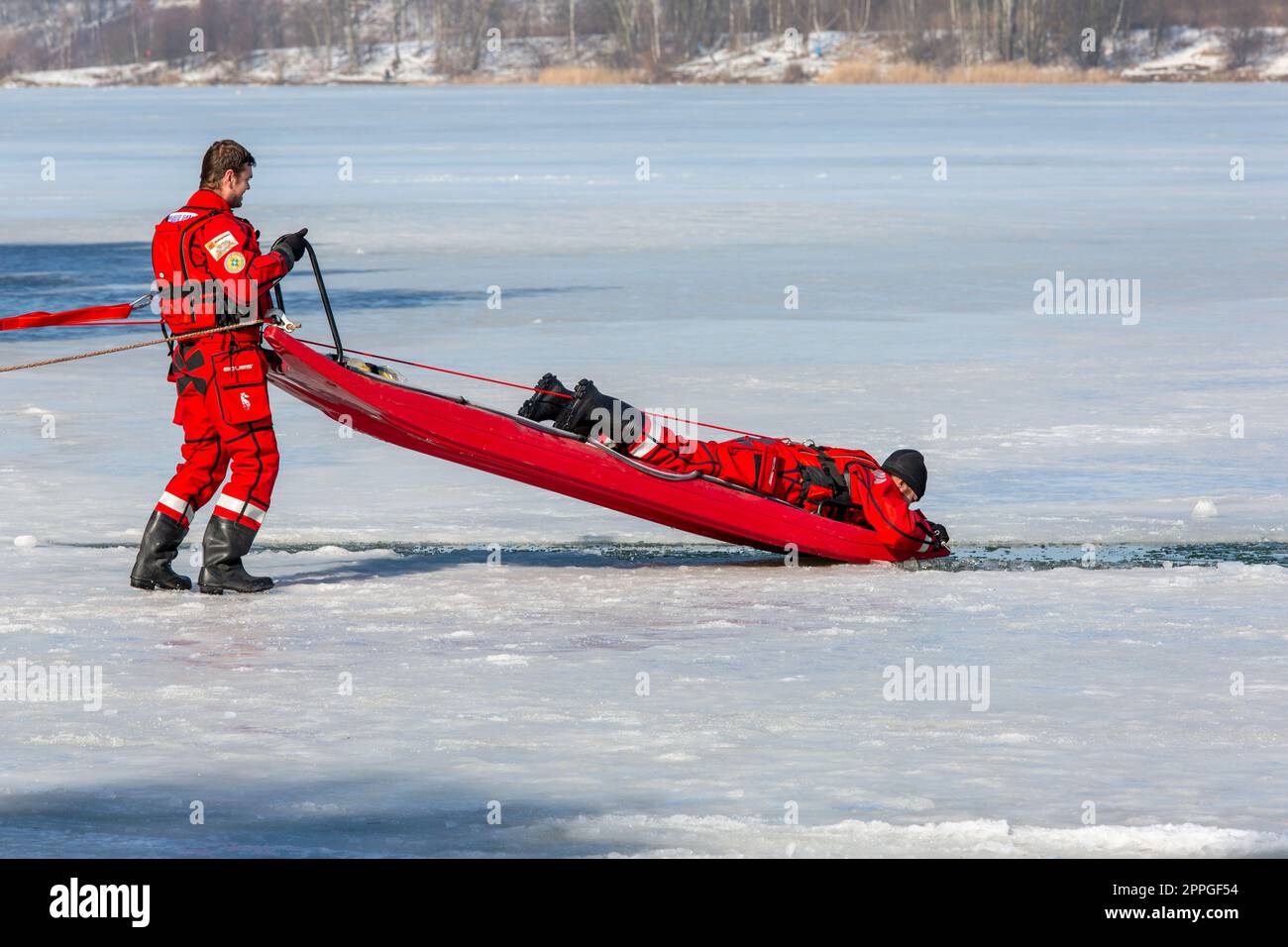 Water rescue exercises in winter on a frozen lake in a hole, Krakow ...