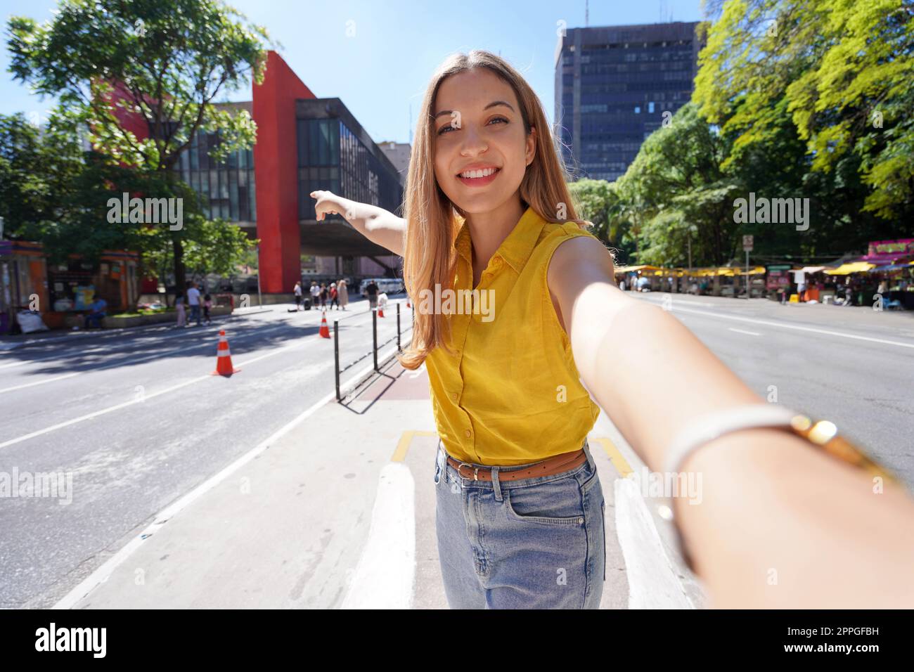 Travel in Sao Paulo, Brazil. Beautiful smiling girl takes self portrait ...