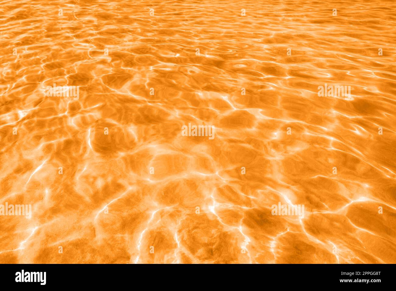 View on ocean water with ripples and flecks. Toned in orange Stock ...