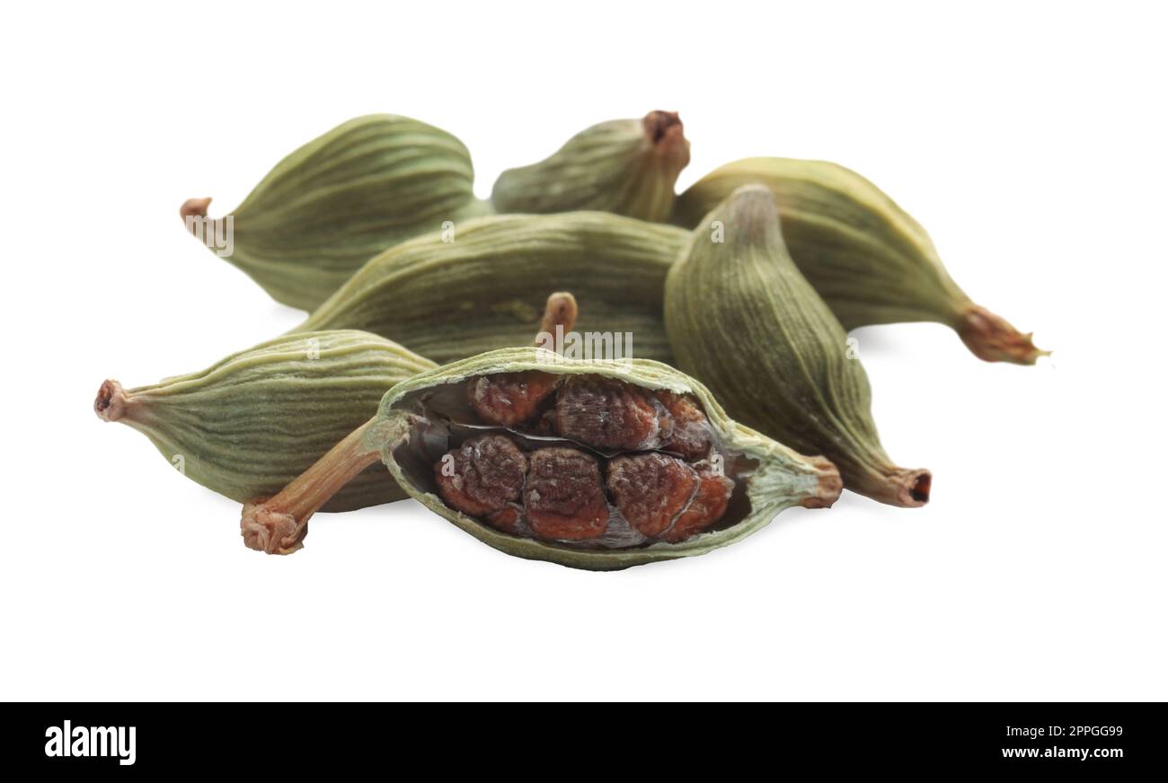 Pile of dry green cardamom pods on white background Stock Photo - Alamy