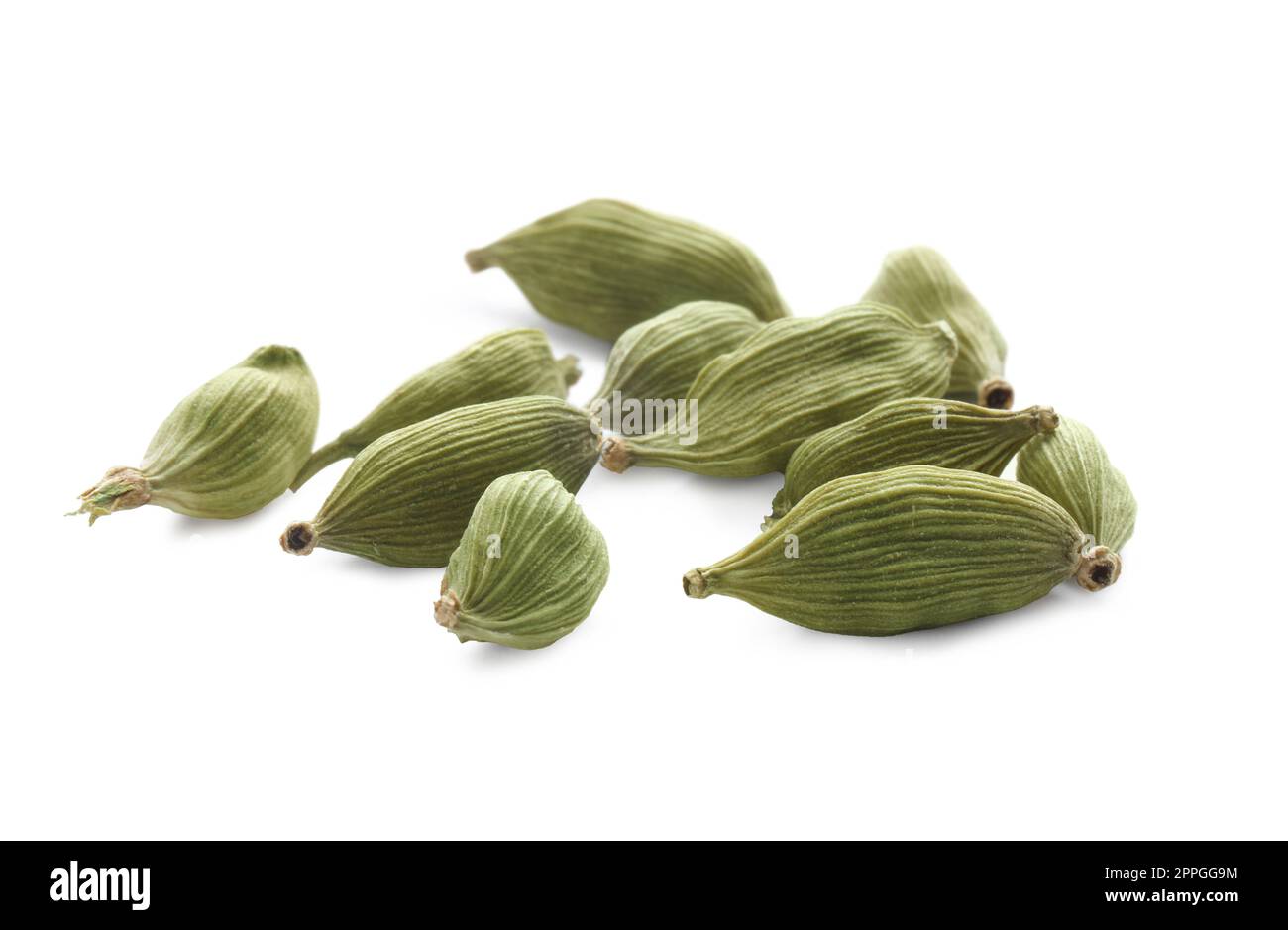 Pile of dry green cardamom pods on white background Stock Photo - Alamy