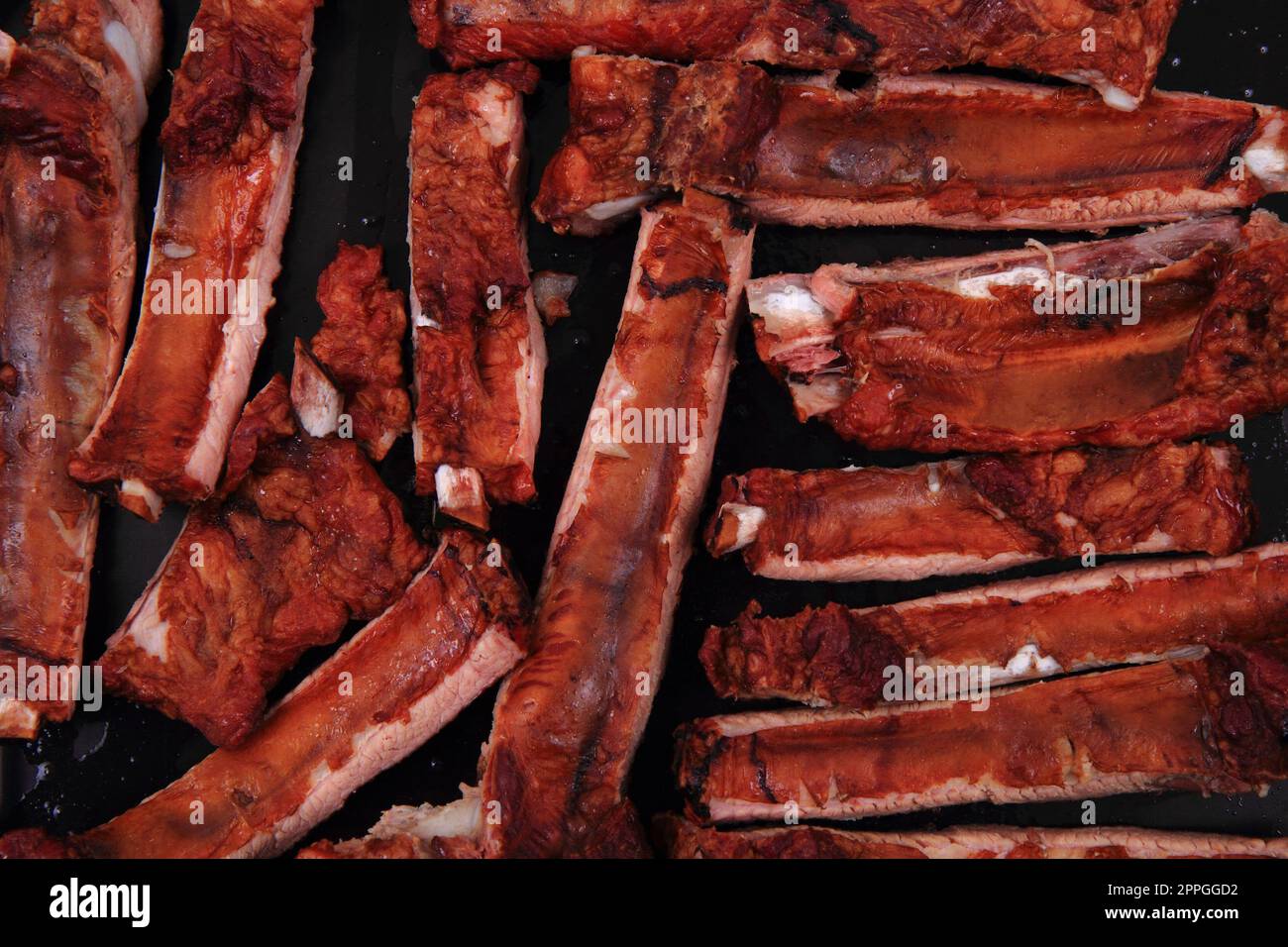 smoked pig ribs as very nice food background Stock Photo - Alamy