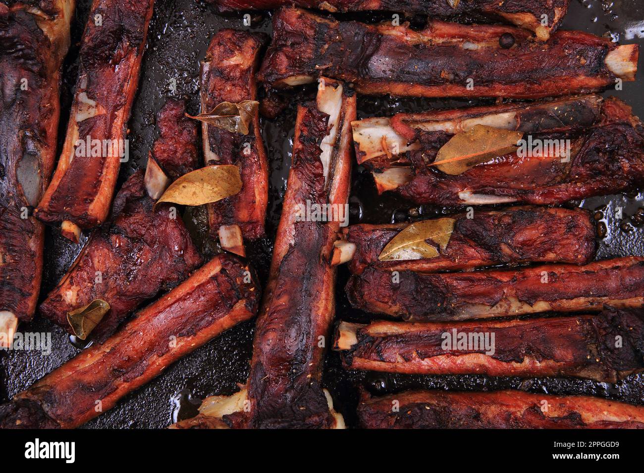 smoked pig ribs as very nice food background Stock Photo - Alamy