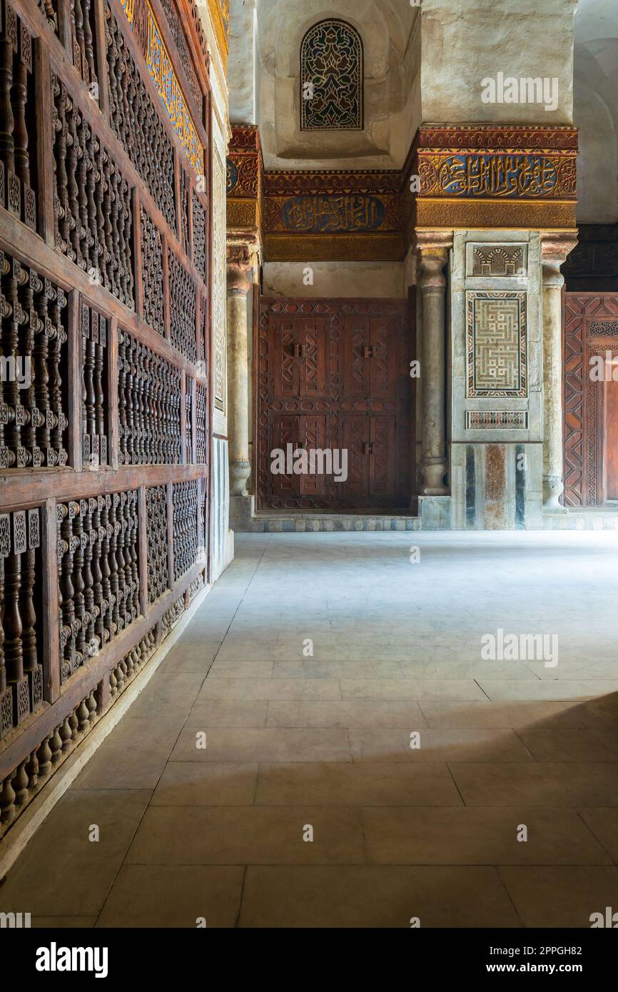 Decorated marble walls surrounding the cenotaph in the mausoleum of ...