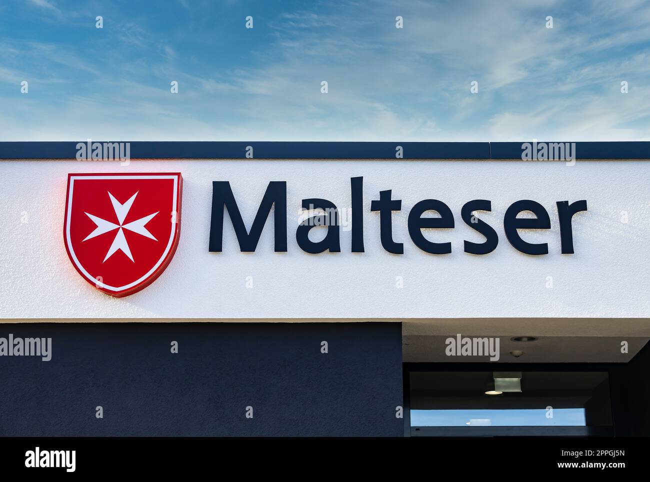 Malteser on House Facade Stock Photo - Alamy