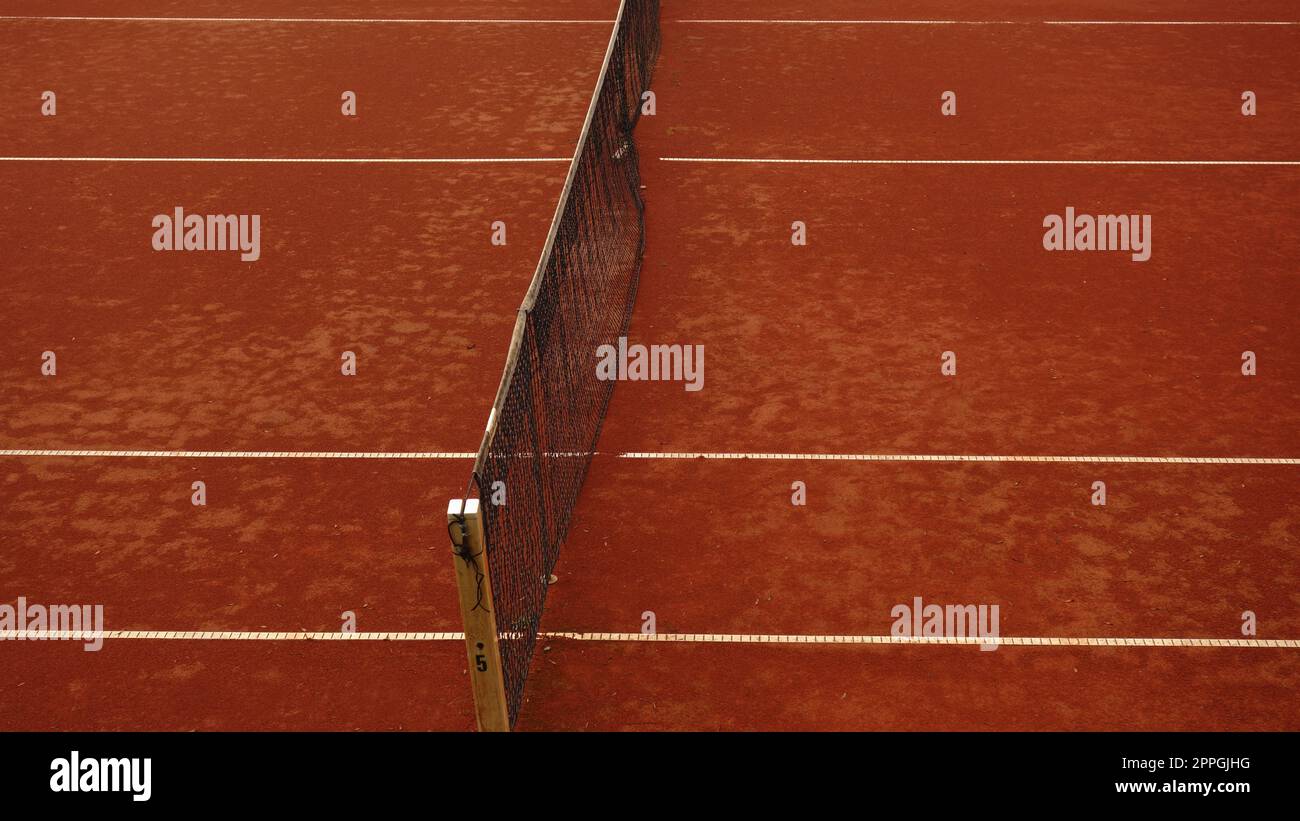 red clay tennis court as background Stock Photo - Alamy