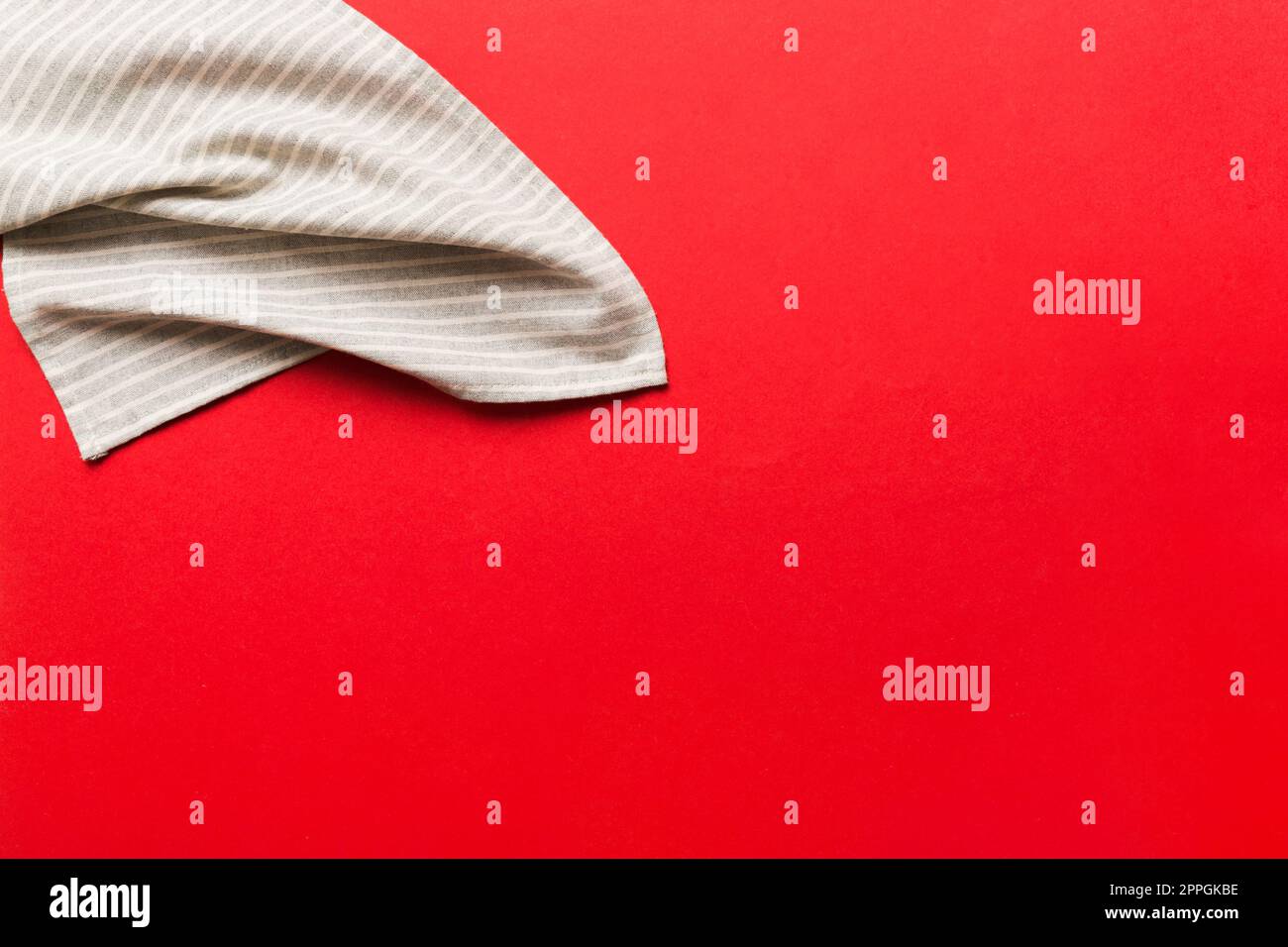 top view with gray kitchen napkin isolated on table background. Folded ...