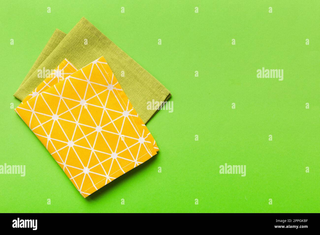 top view with yellow empty kitchen napkin isolated on table background ...
