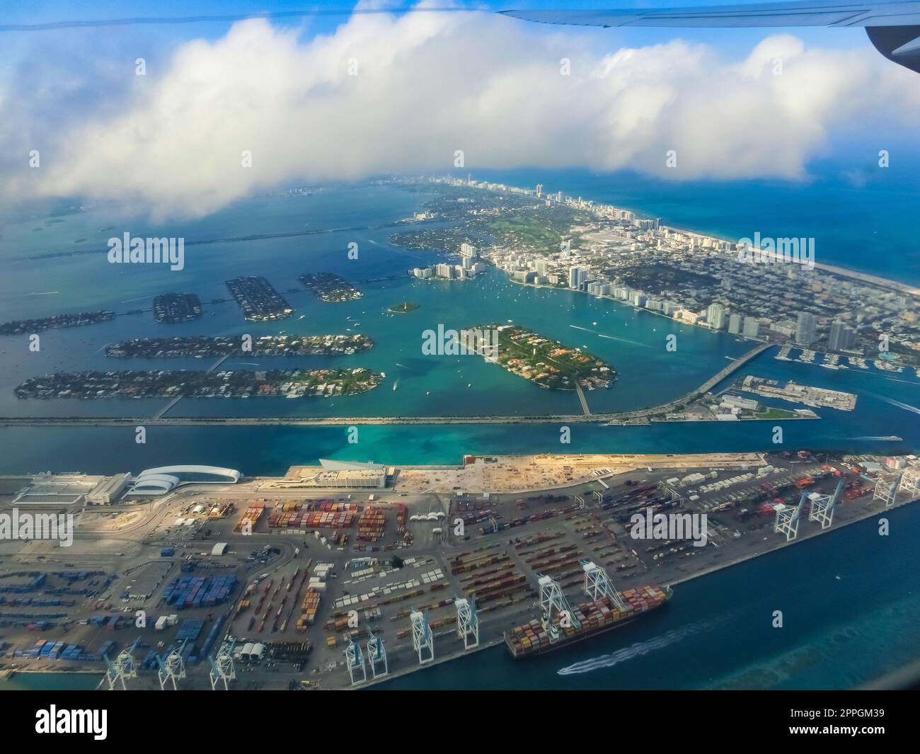 Miami from airplane porthole at day with blue sky Stock Photo - Alamy