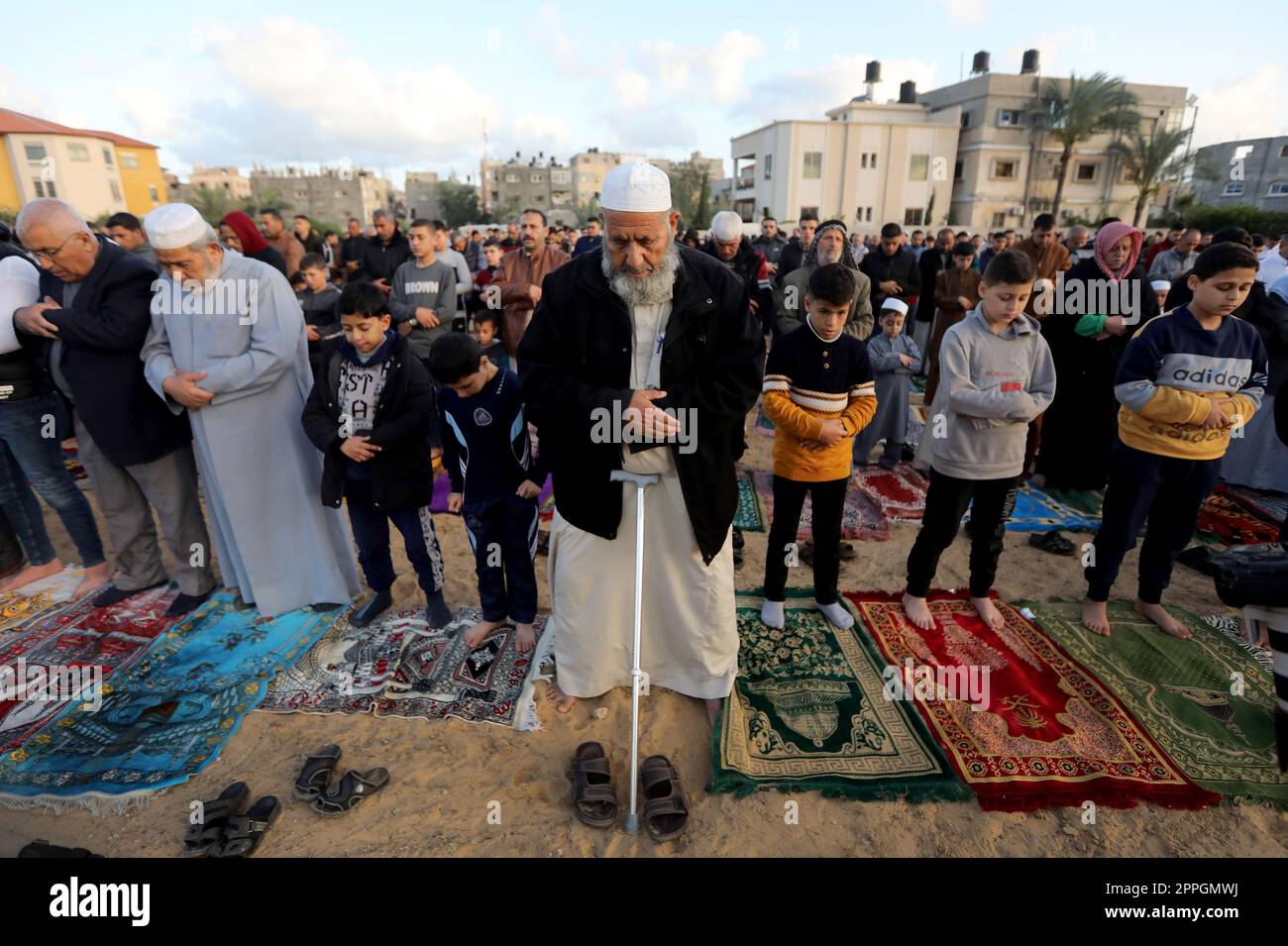 Palestinians perform Eid al-Fitr prayers at sunrise in Khan Yunis in ...