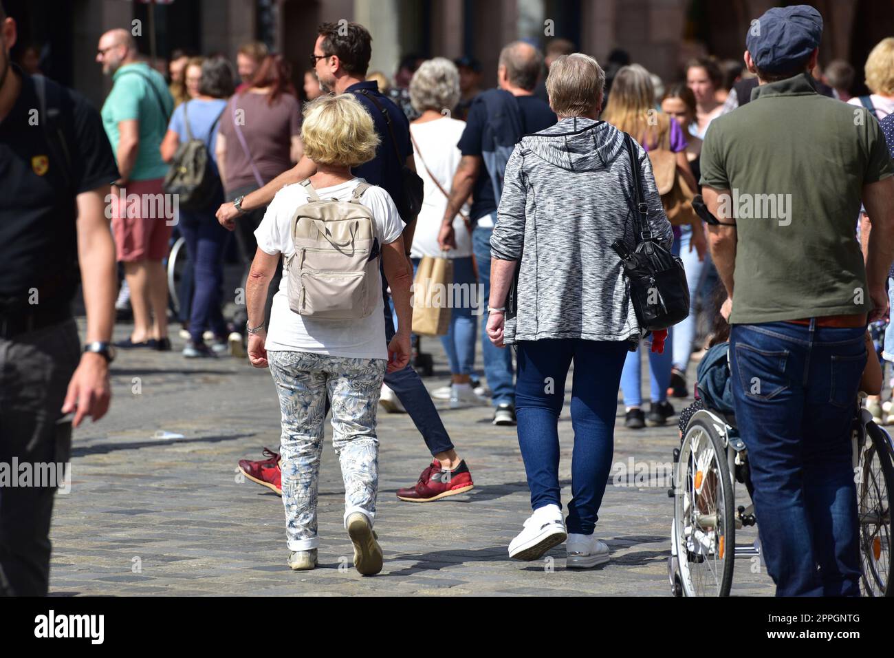 Street scene with many people walking Stock Photo - Alamy