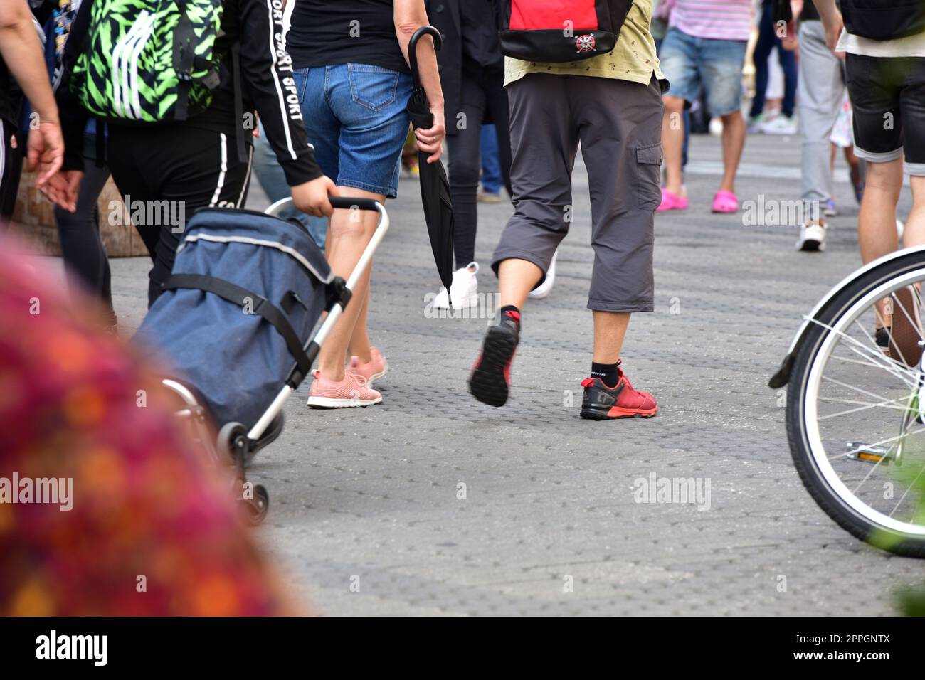 Street scene with many people walking Stock Photo - Alamy