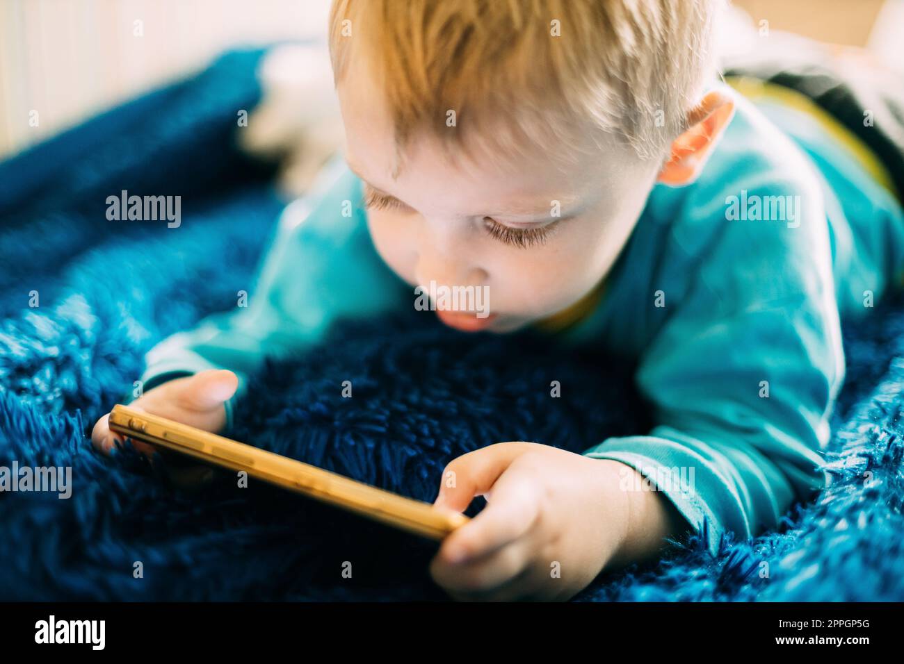 Child young blond boy playing hi-res stock photography and images - Alamy