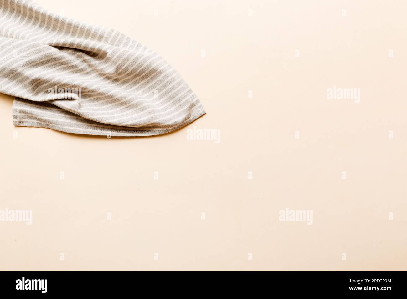 top view with gray kitchen napkin isolated on table background. Folded ...