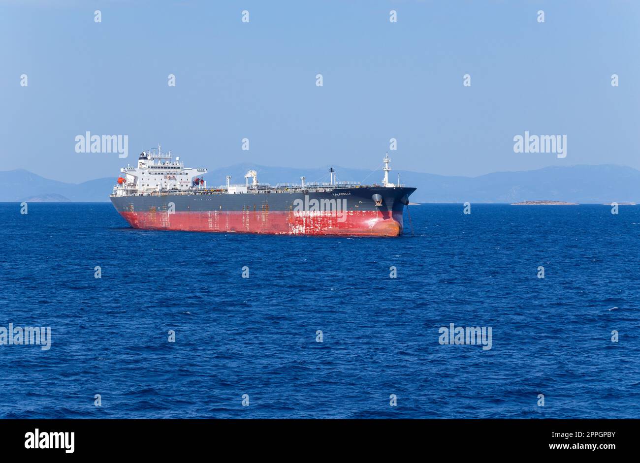 Merchant vessels and cargo container Stock Photo - Alamy