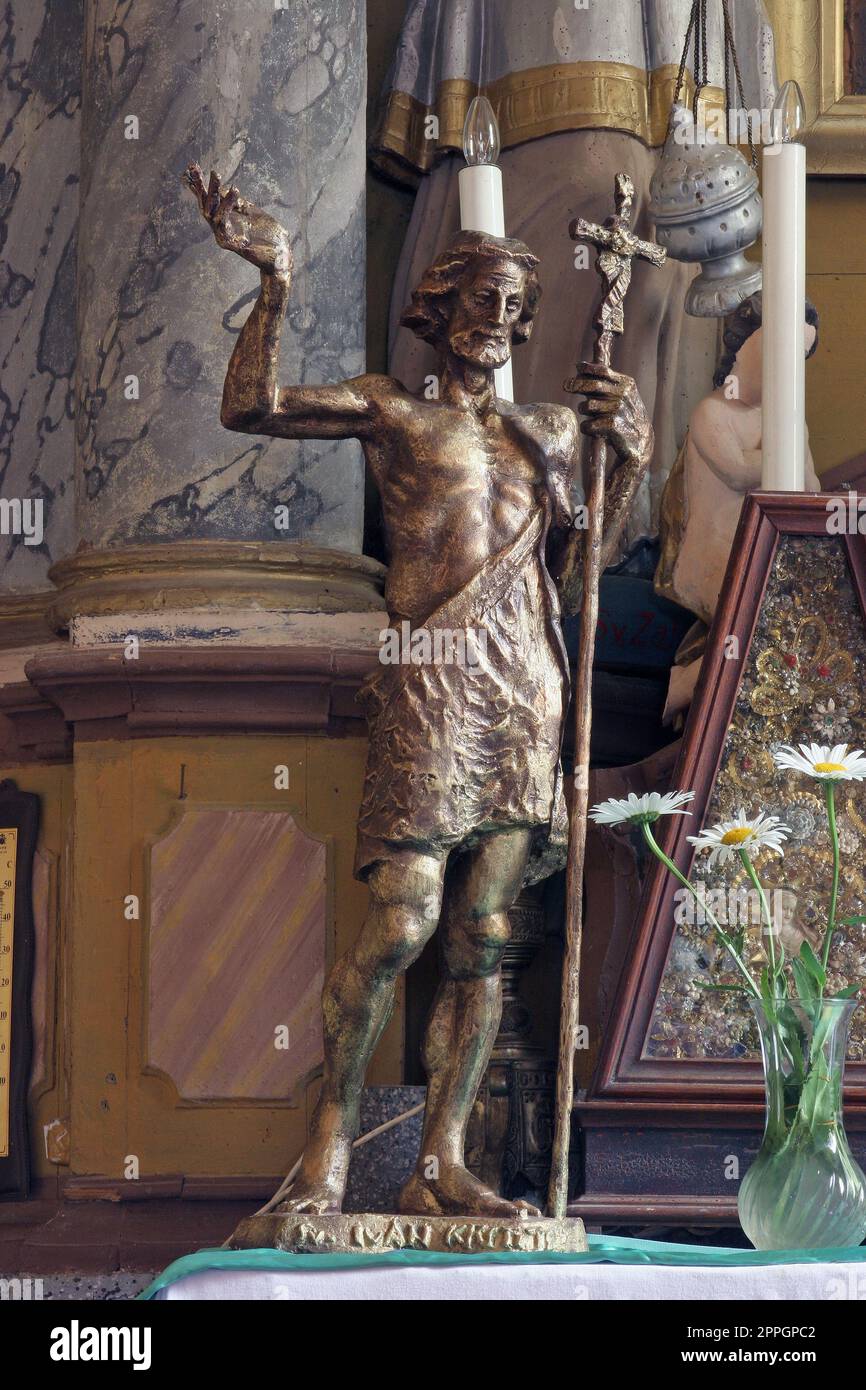 Saint John the Baptist, statue on the high altar in the church of Saint ...