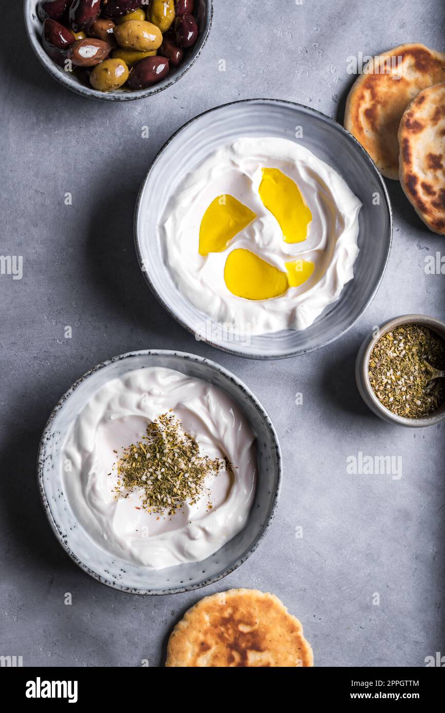 Labneh yogurt cream cheese with olive oil and zaatar close up ...