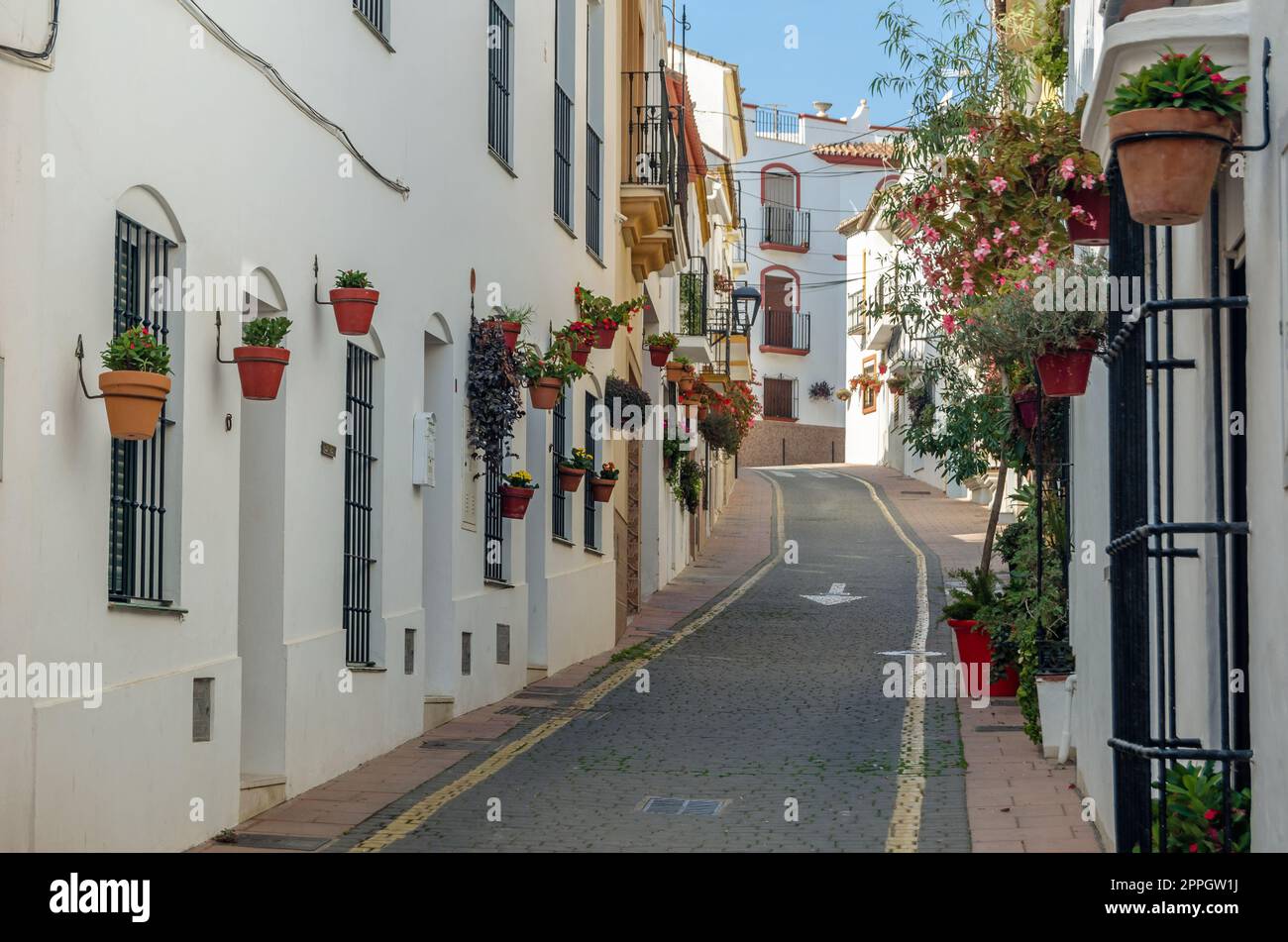 Narrow streets in the center of Estepona, typical Andalusian town in ...
