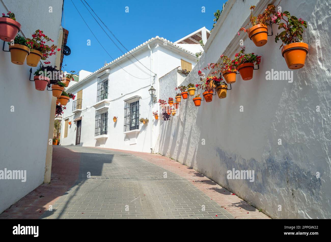 Narrow streets in the center of Estepona, typical Andalusian town in ...