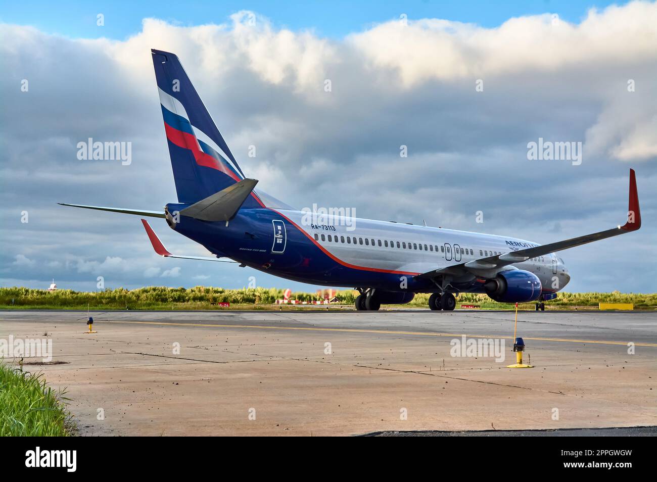 The Boeing aircraft is taxiing along the runway. Talagi Airport ...