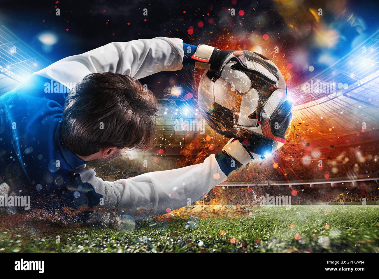 Goalkeeper catches a fast fiery soccer ball Stock Photo - Alamy