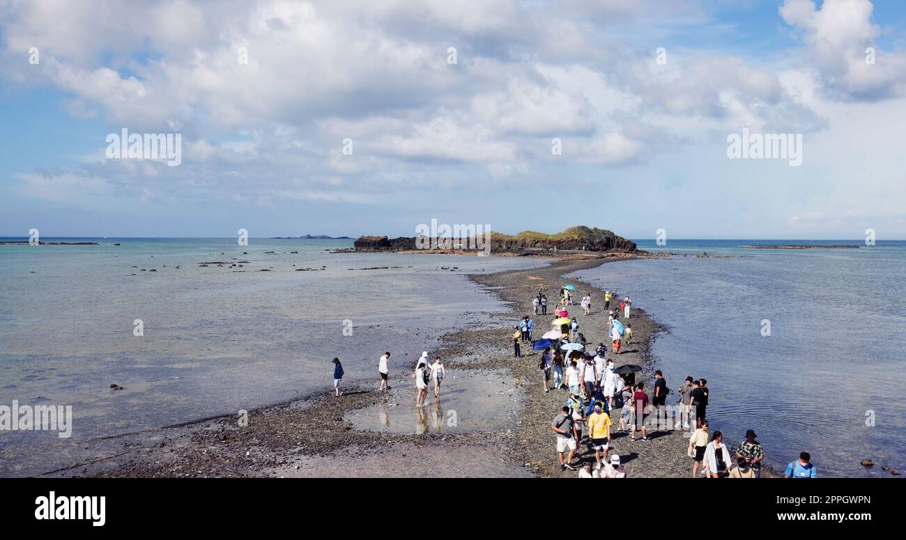 Penghu, Taiwan 25 June 2022: Low tide walking path connect Kueibishan ...