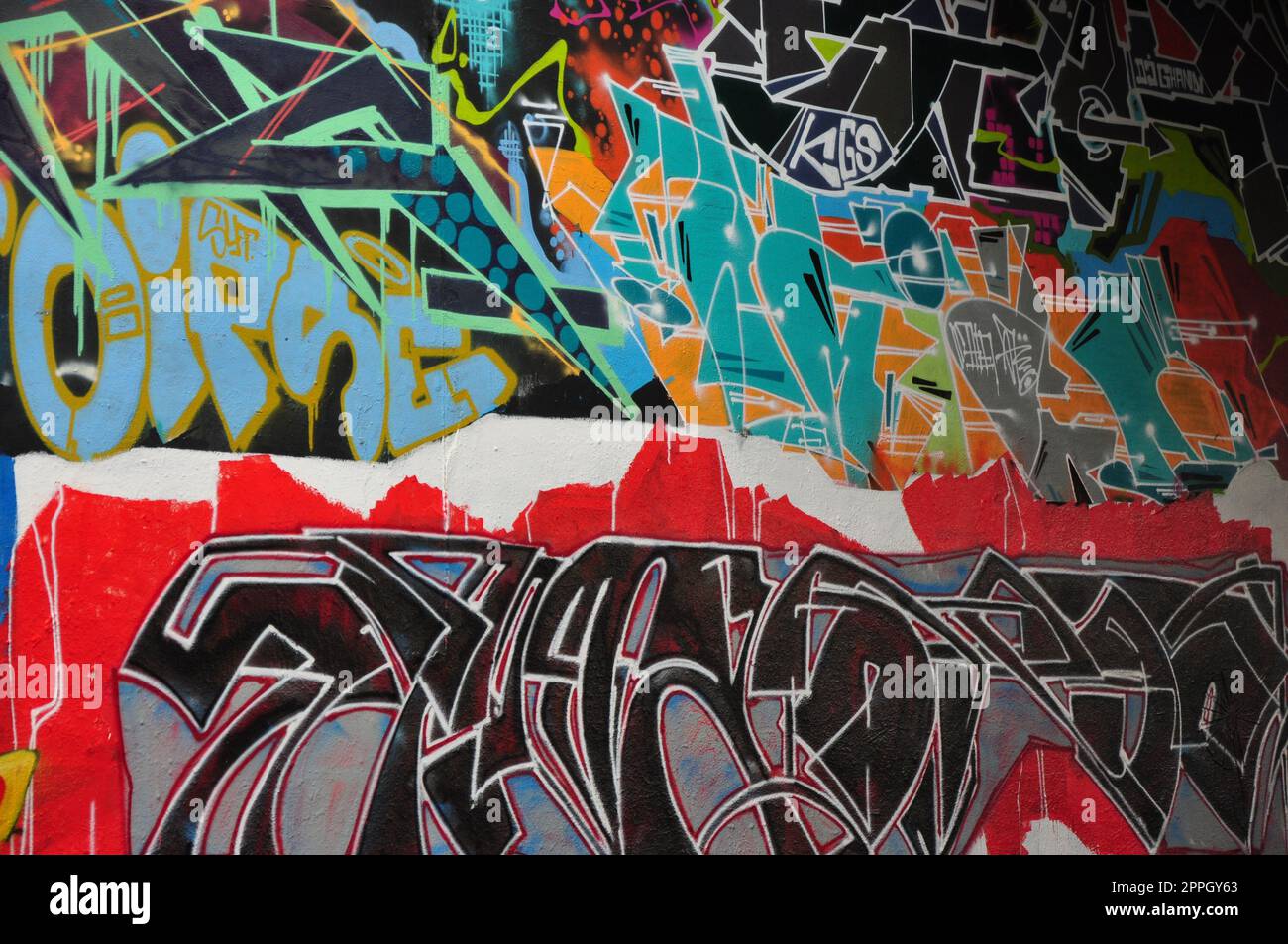Vertical closeup of a colorful legal public graffiti wall on Tesnov ...