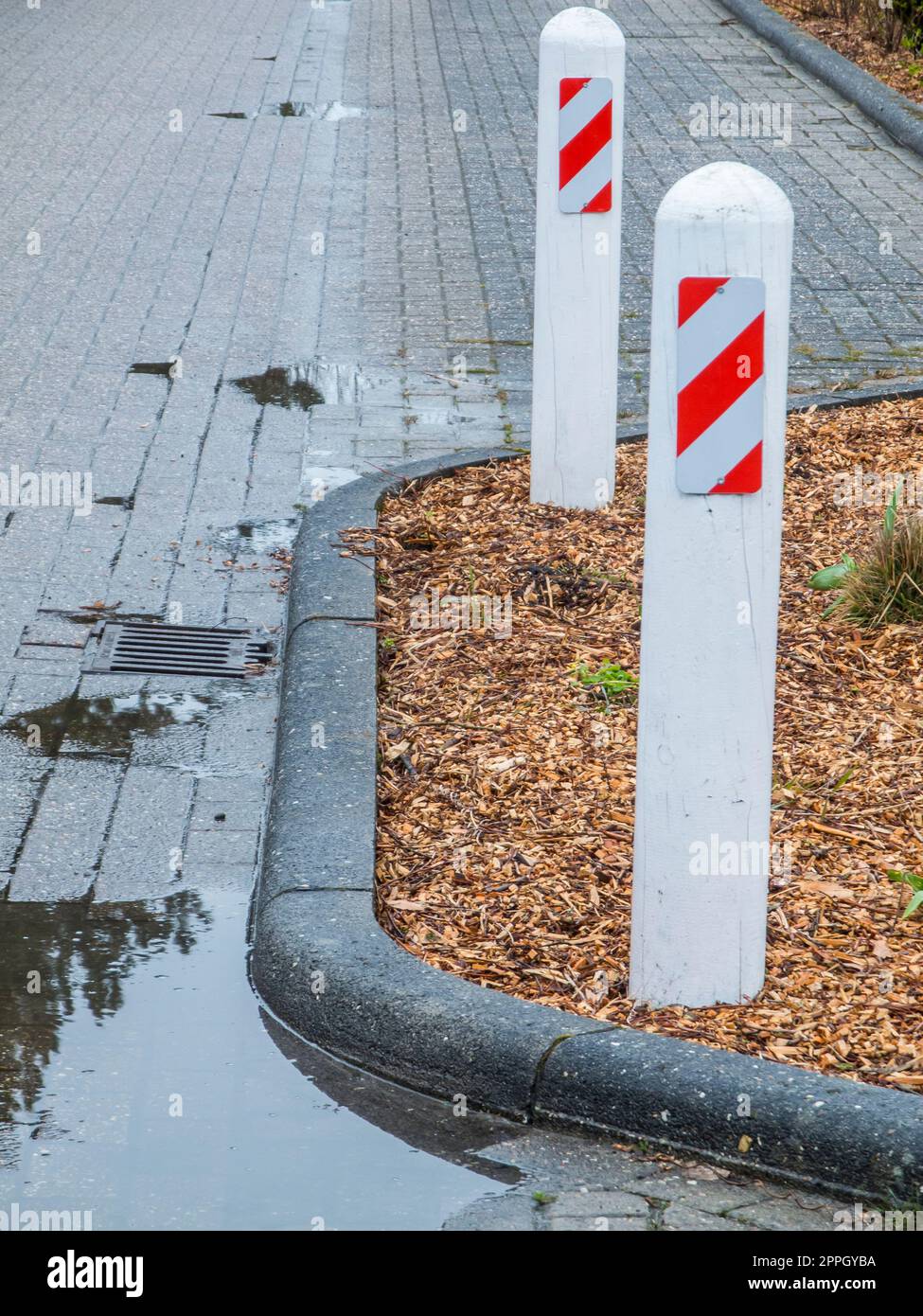 Traffic bollards at a road bottleneck Stock Photo - Alamy