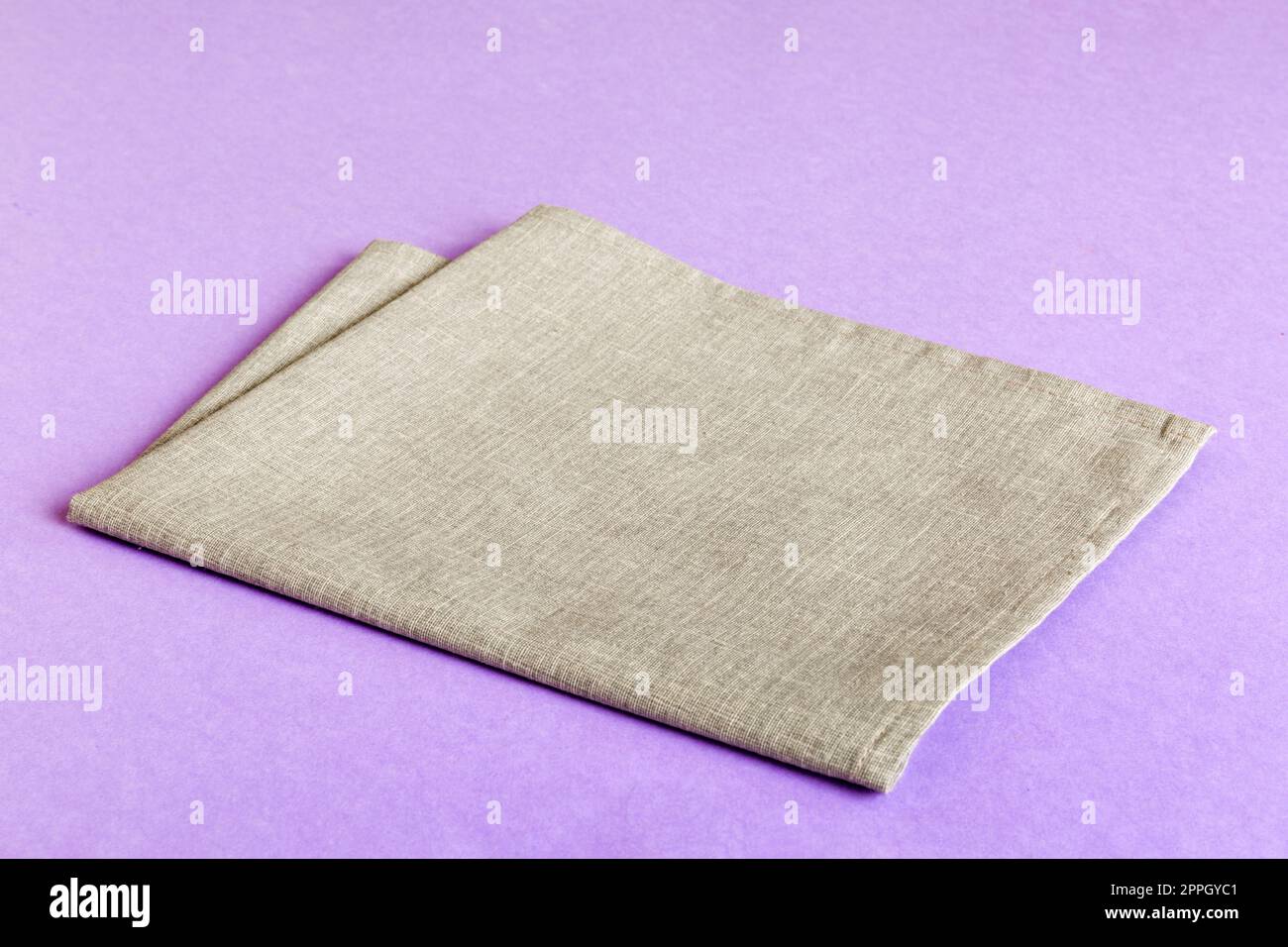 top view with gray kitchen napkin isolated on table background. Folded ...