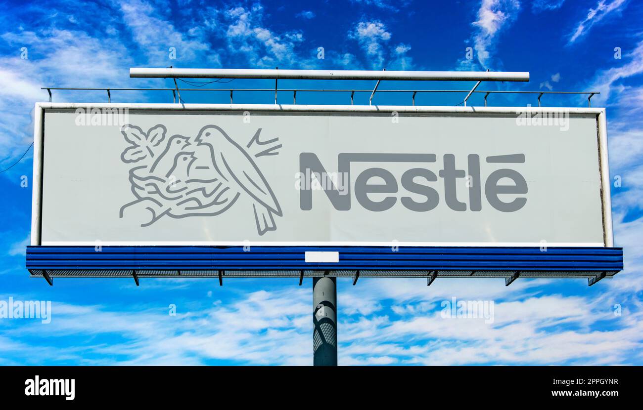 Advertisement billboard displaying logo of Nestle Stock Photo - Alamy