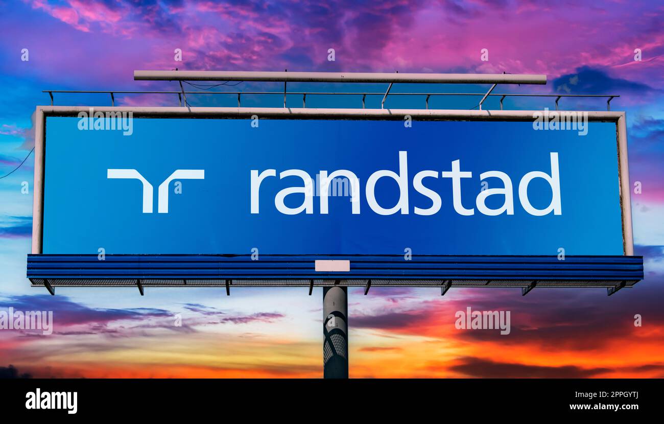 Advertisement billboard displaying logo of Randstad Stock Photo - Alamy