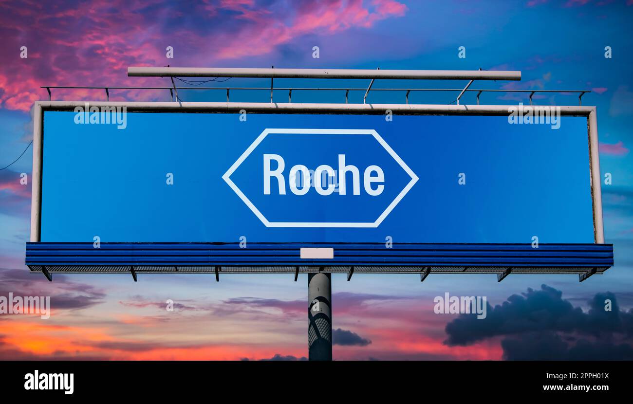 Advertisement billboard displaying logo of Roche Stock Photo - Alamy