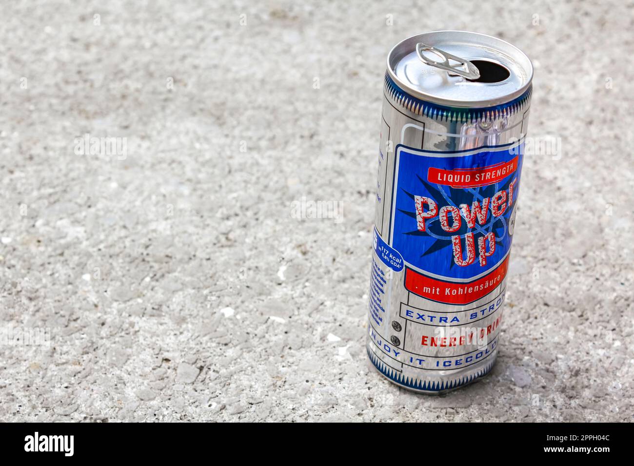 Energy drink power up can on the floor gray background Stock Photo - Alamy